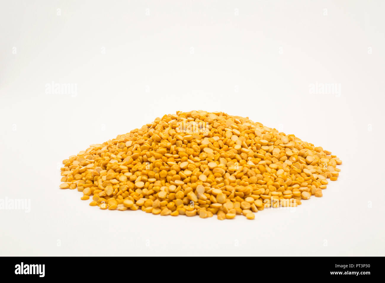 Raw yellow split peas isolated on white background Stock Photo - Alamy
