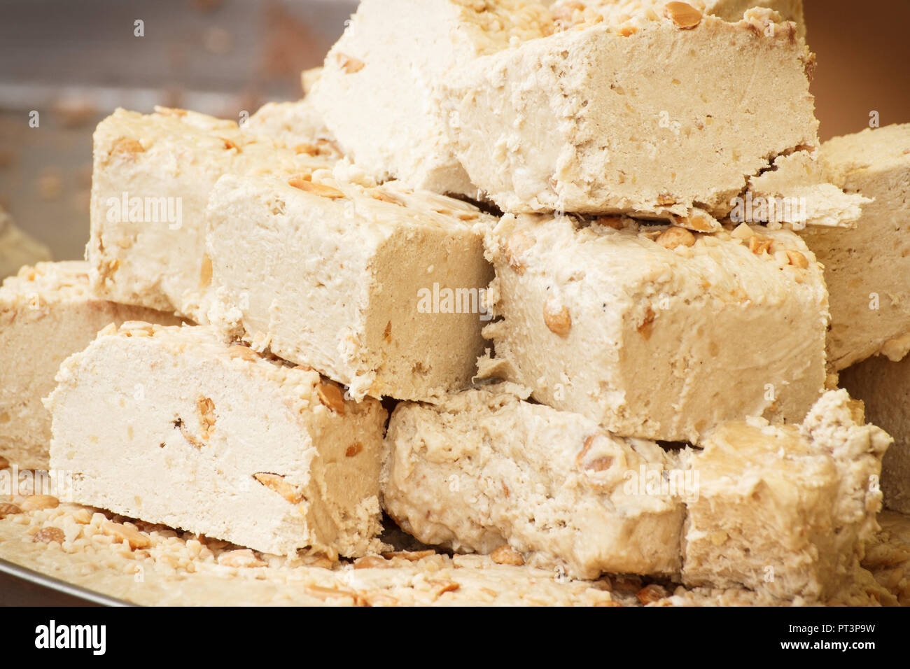 Portion of halva with vanilla and pistachio on stall at bazaar ...