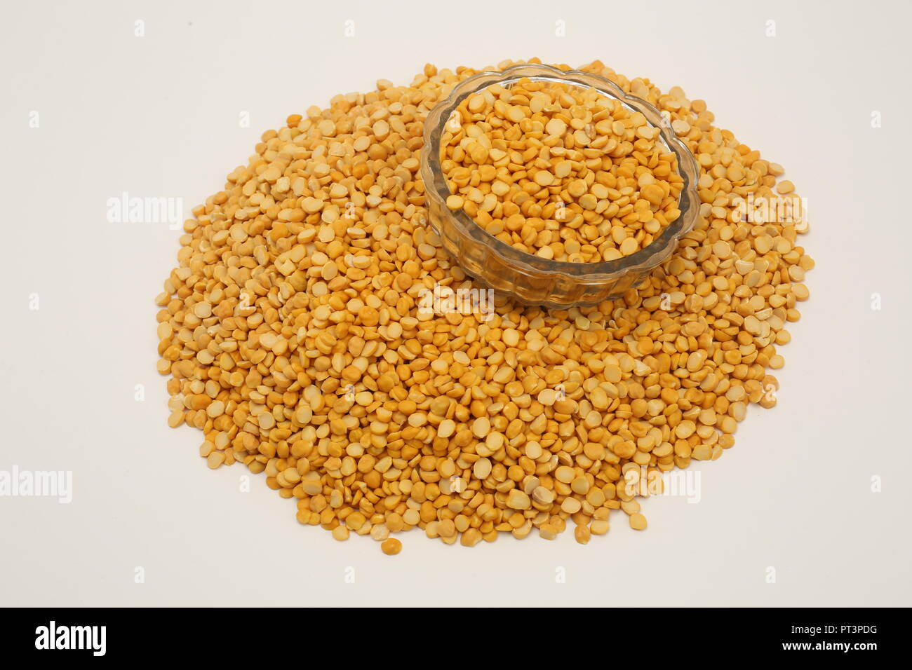 Yellow split peas boot chana dal with bowl isolated on white background ...