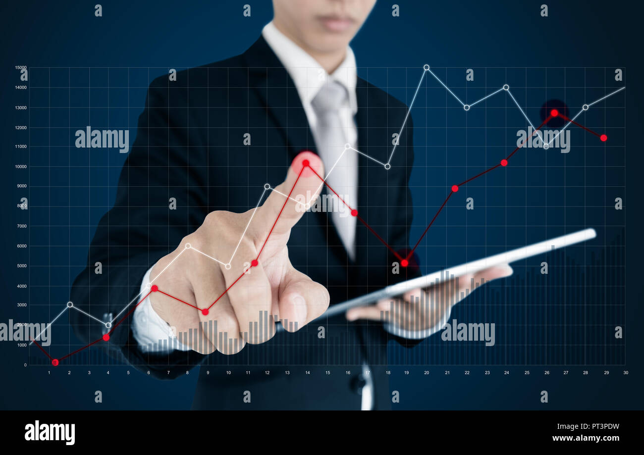 Businessman pointing raising graph on screen. Business growth ...
