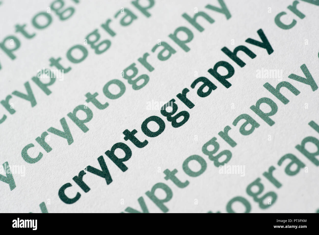 word cryptography printed on white paper macro Stock Photo - Alamy