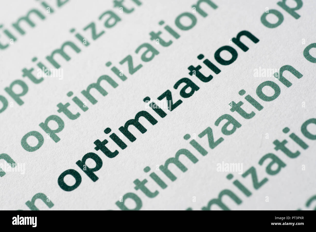 word optimization printed on white paper macro Stock Photo - Alamy