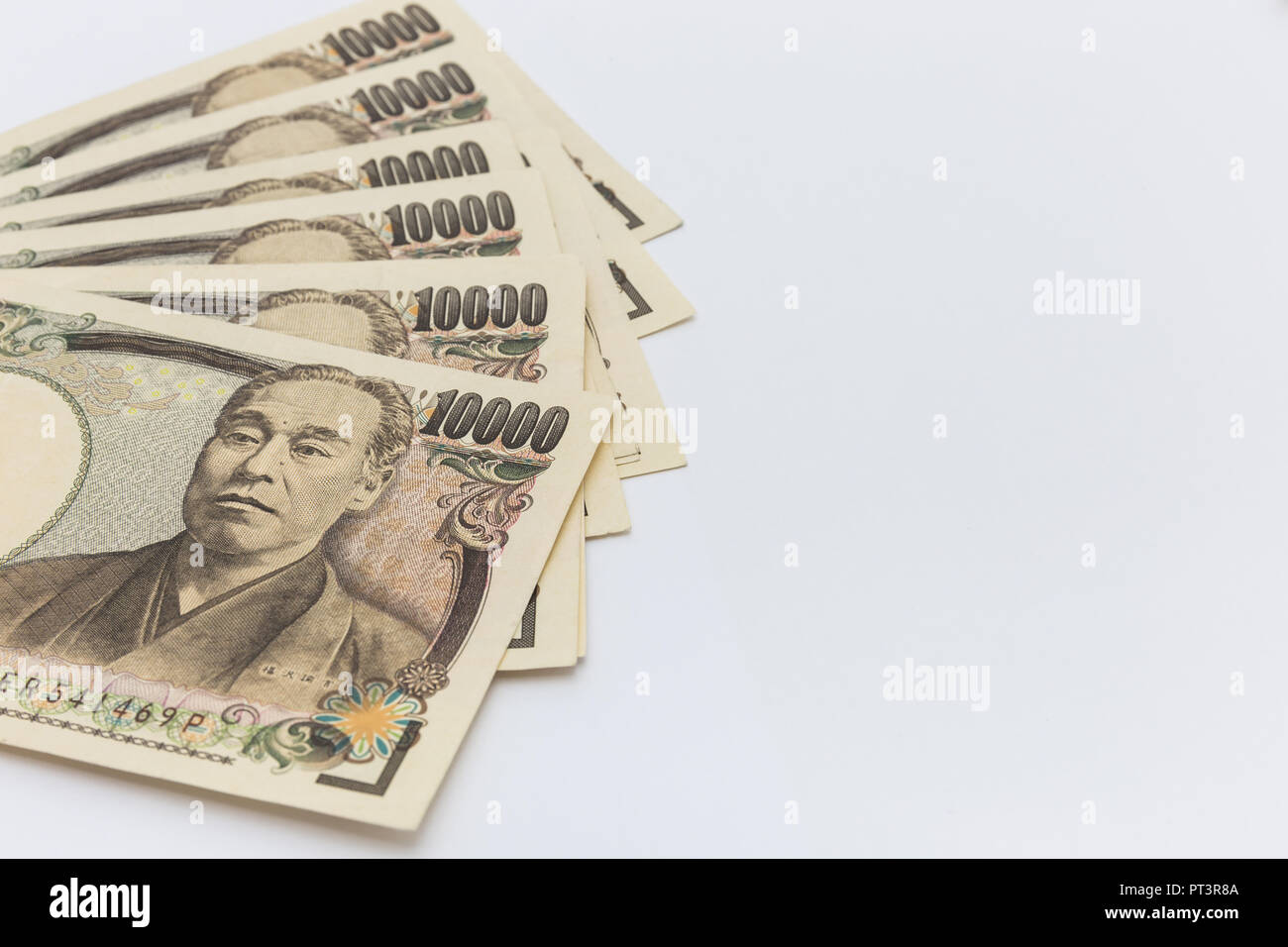 Japanese yen banknotes concept on white background with copy space ...