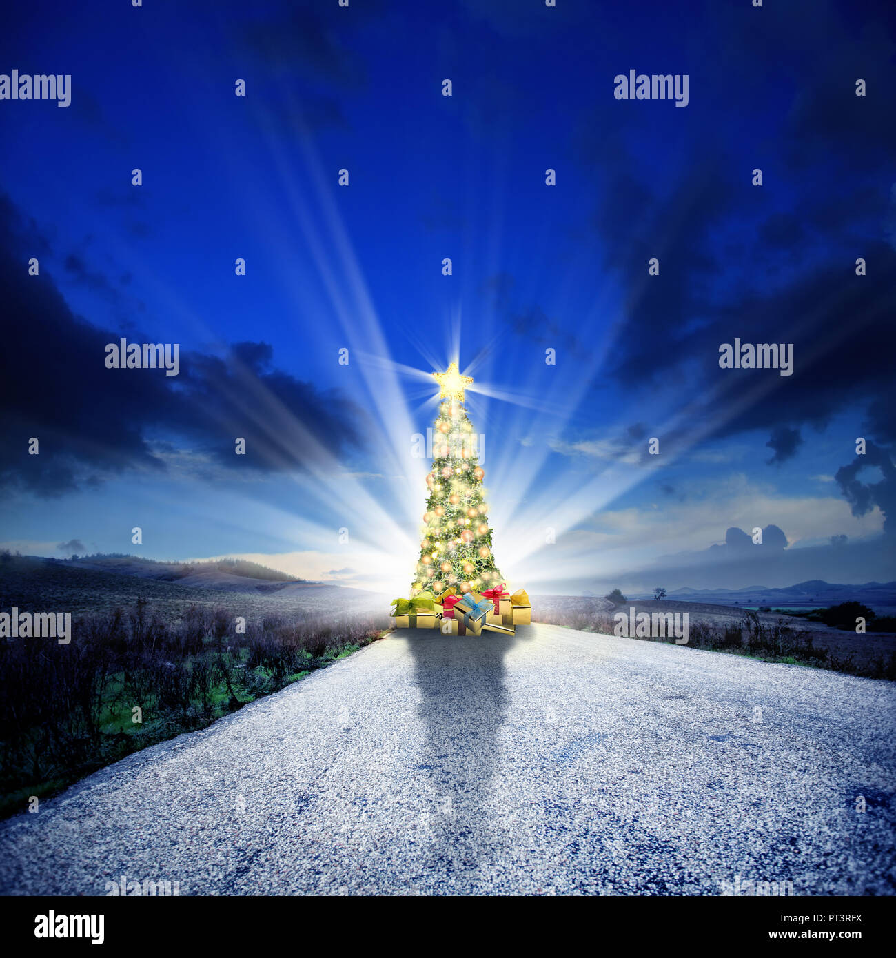 Conceptual image of road and decorated shiny Christmas tree over cloudy ...
