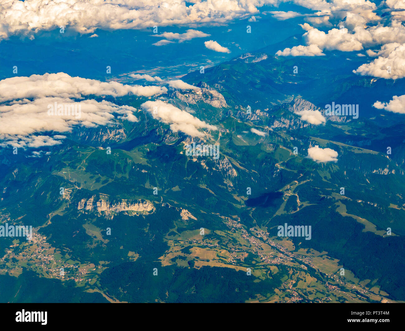 Top aerial view of villages in Switzerland mountains at summer time ...
