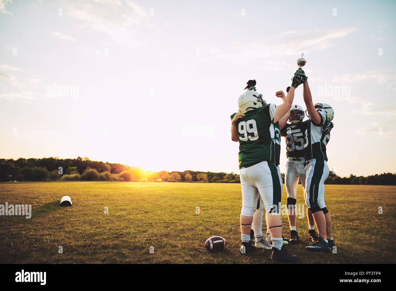 Football celebrating holding trophy hi-res stock photography and images ...