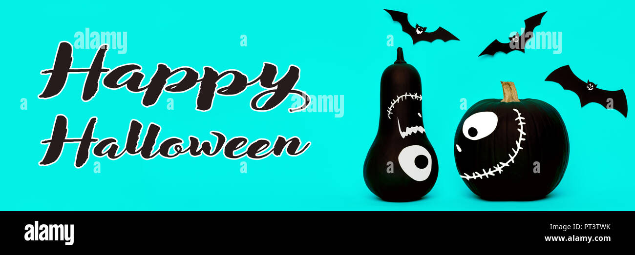 Cute Halloween pumpkins with funny smiling faces looking at each other ...