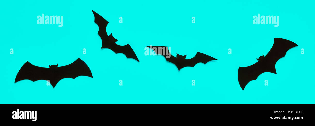 Halloween and decoration concept. Black paper bats flying over pastel ...