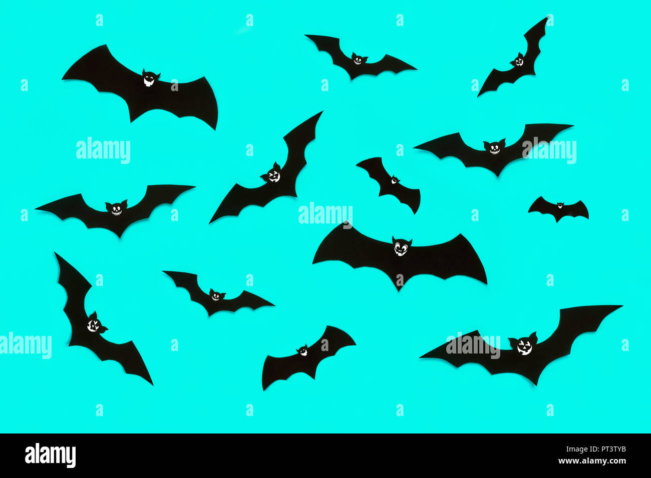 Halloween and decoration concept. Cute smiling black paper bats flying ...