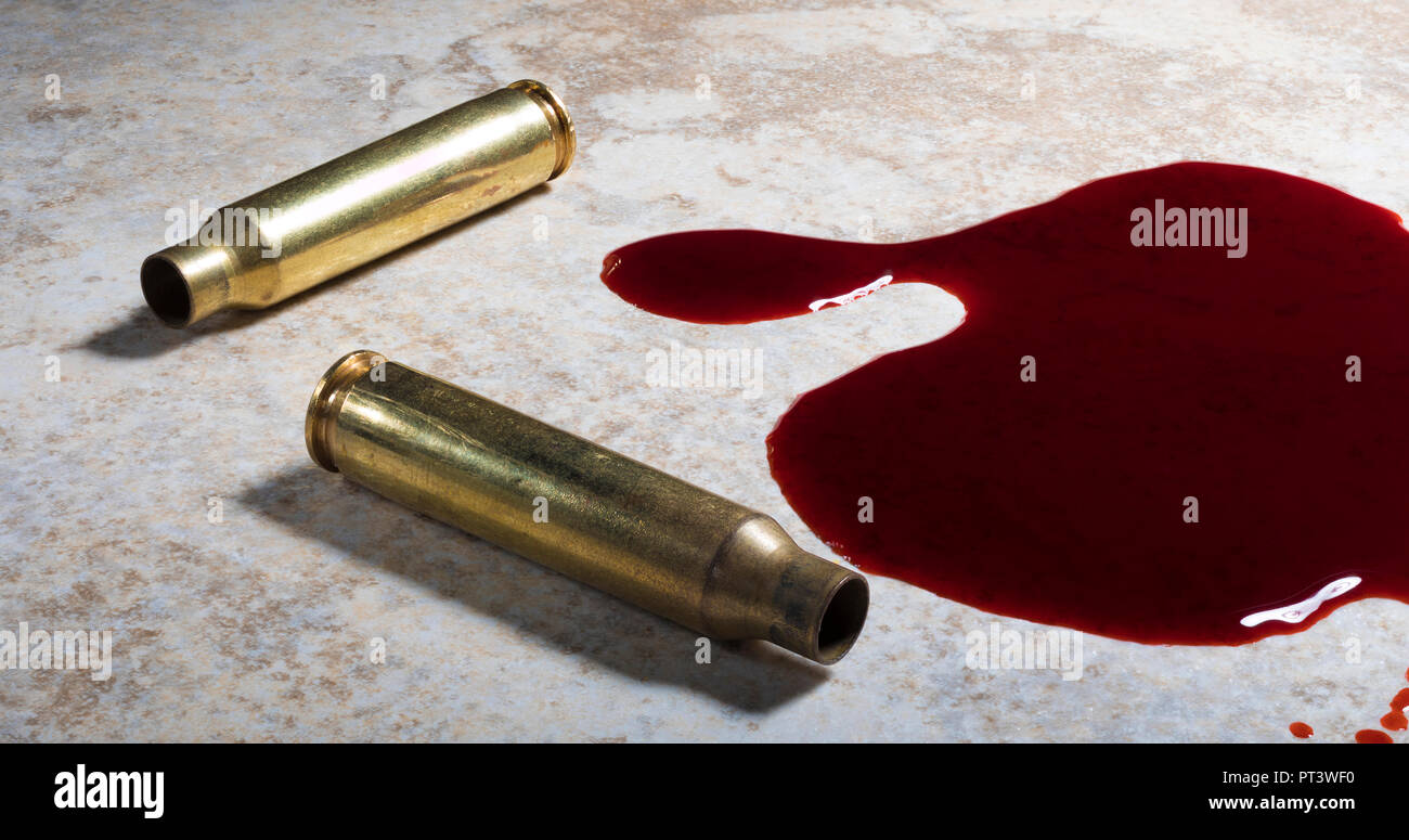 Empty brass from an assault rifle on the floor with blood Stock Photo ...
