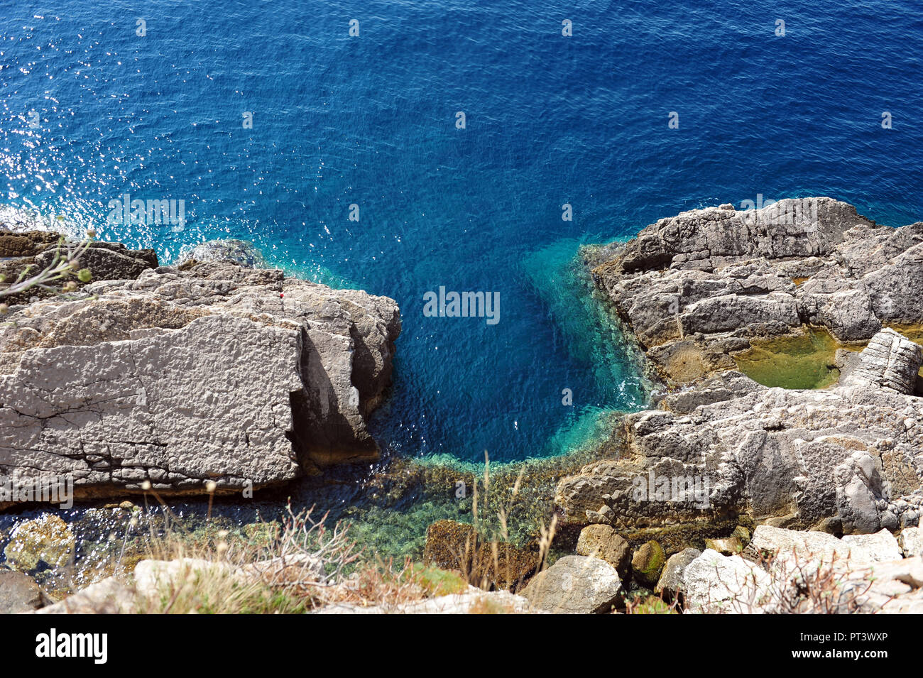 High angle view of white cliffs and blue sea in Montenegro. Crystal ...