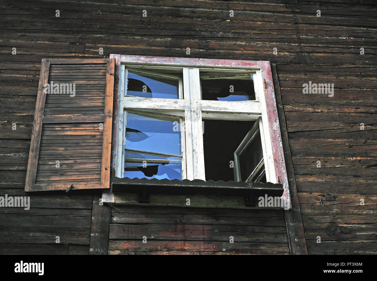 Window of wooden abandoned house in Alps Stock Photo - Alamy