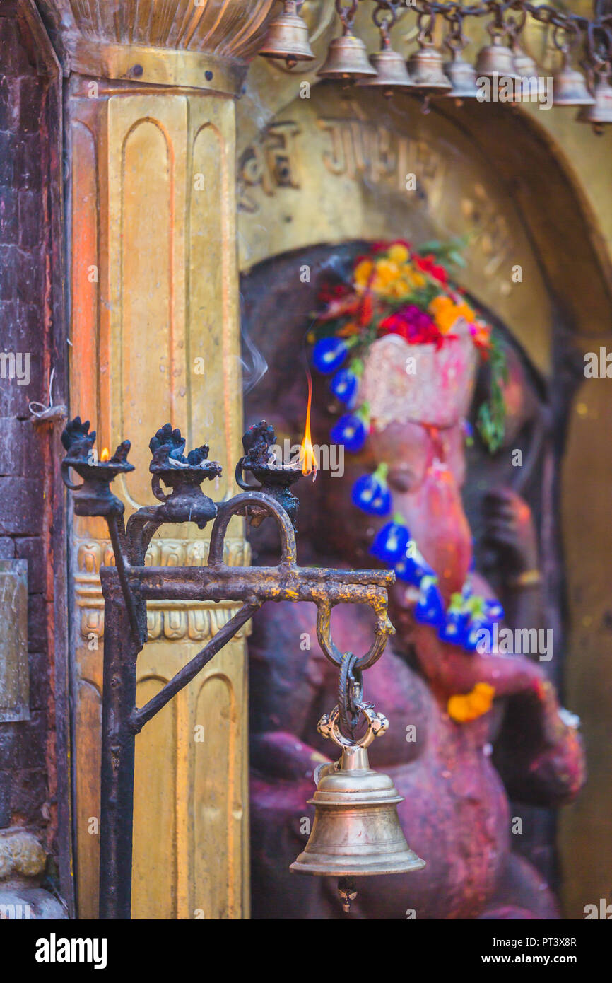 Hindu God with Bells and Holy lamps in the Temple Stock Photo - Alamy