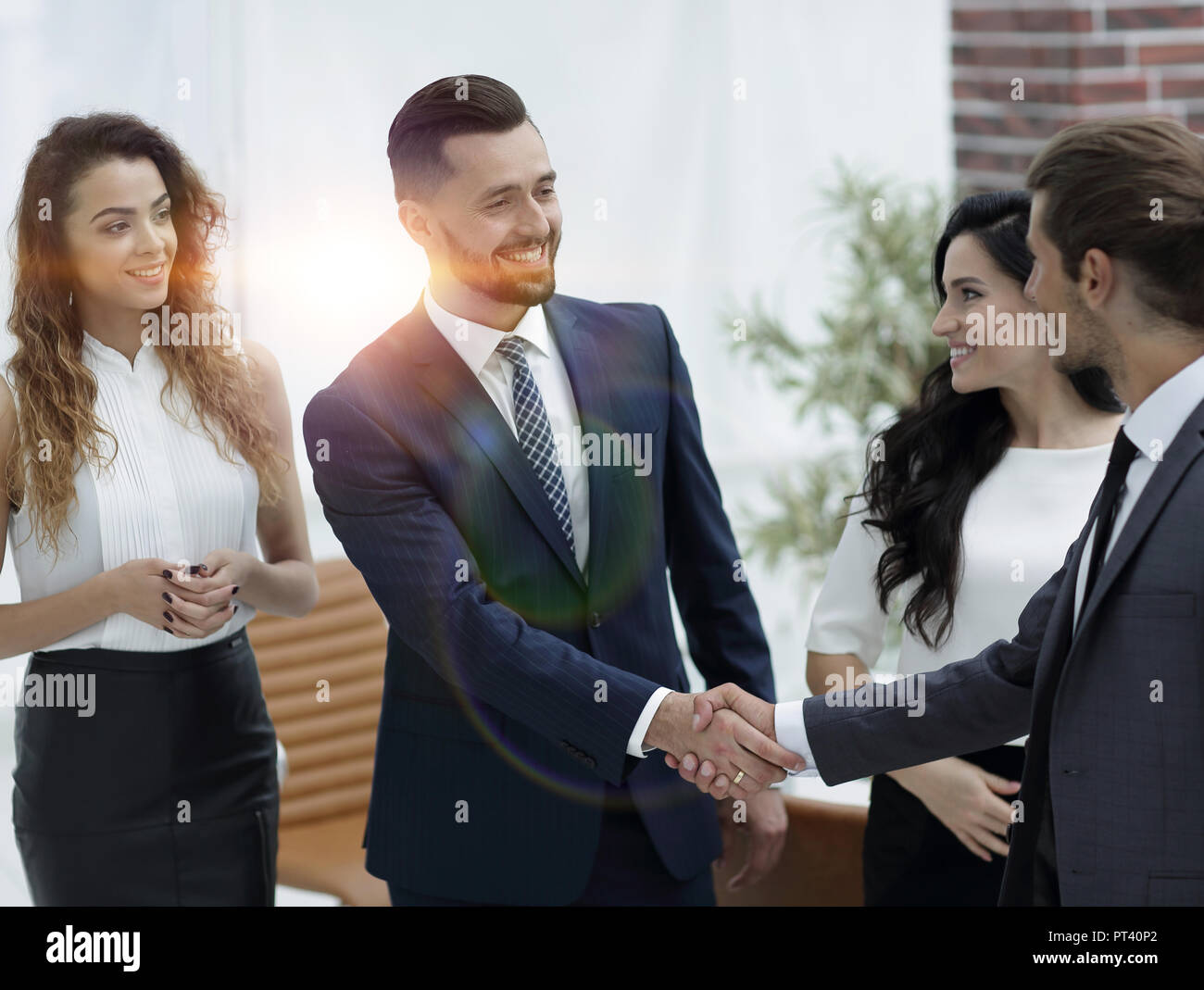handshake business partners in the office.the concept of partnership Stock Photo - Alamy
