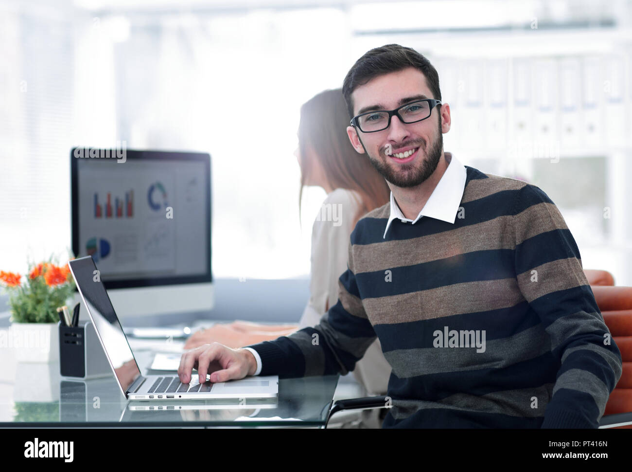 portrait of a successful employee at a Desk in the office Stock Photo ...