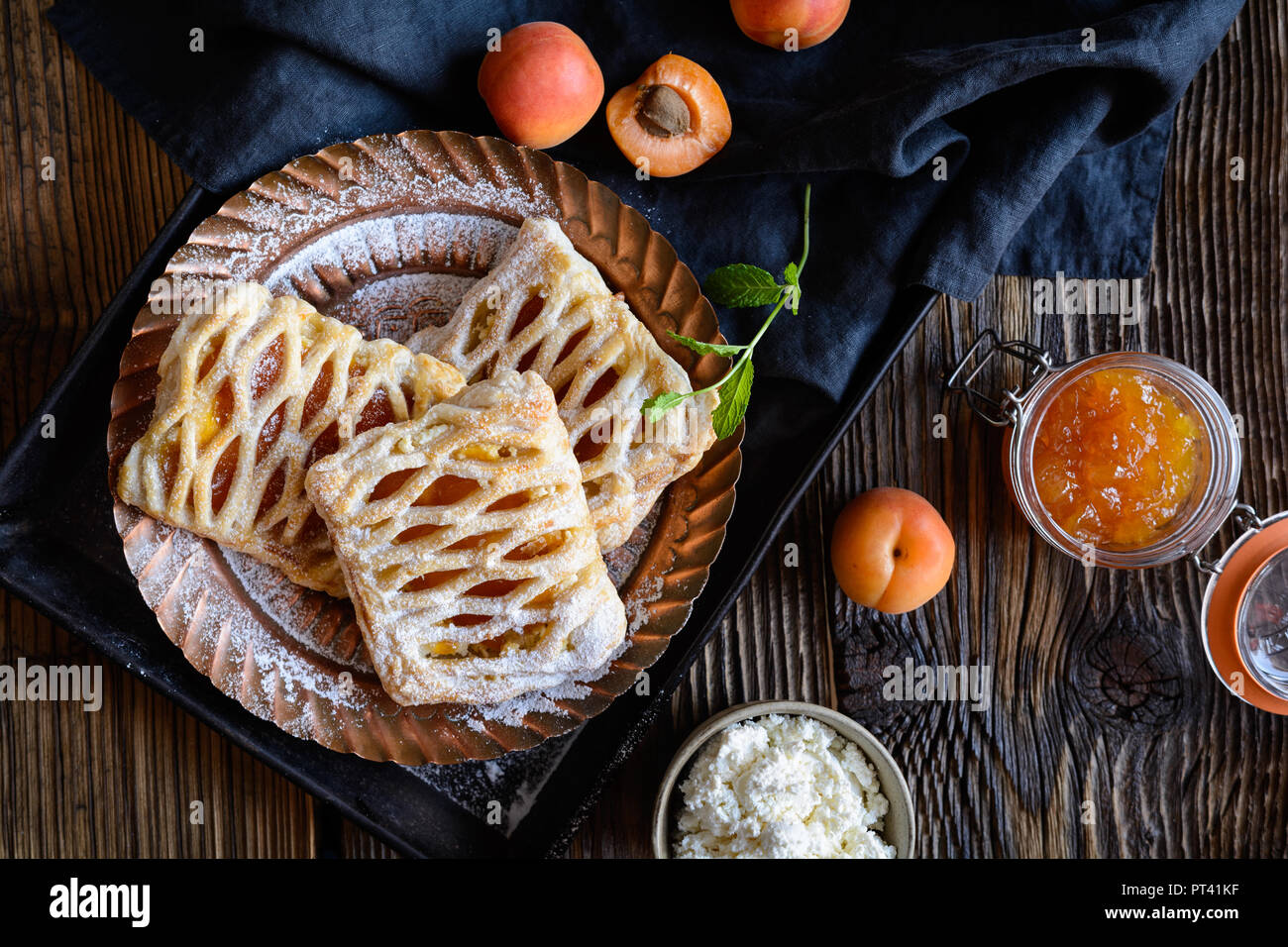 Delicious puff pastry pies filled with apricot jam and cottage cheese ...