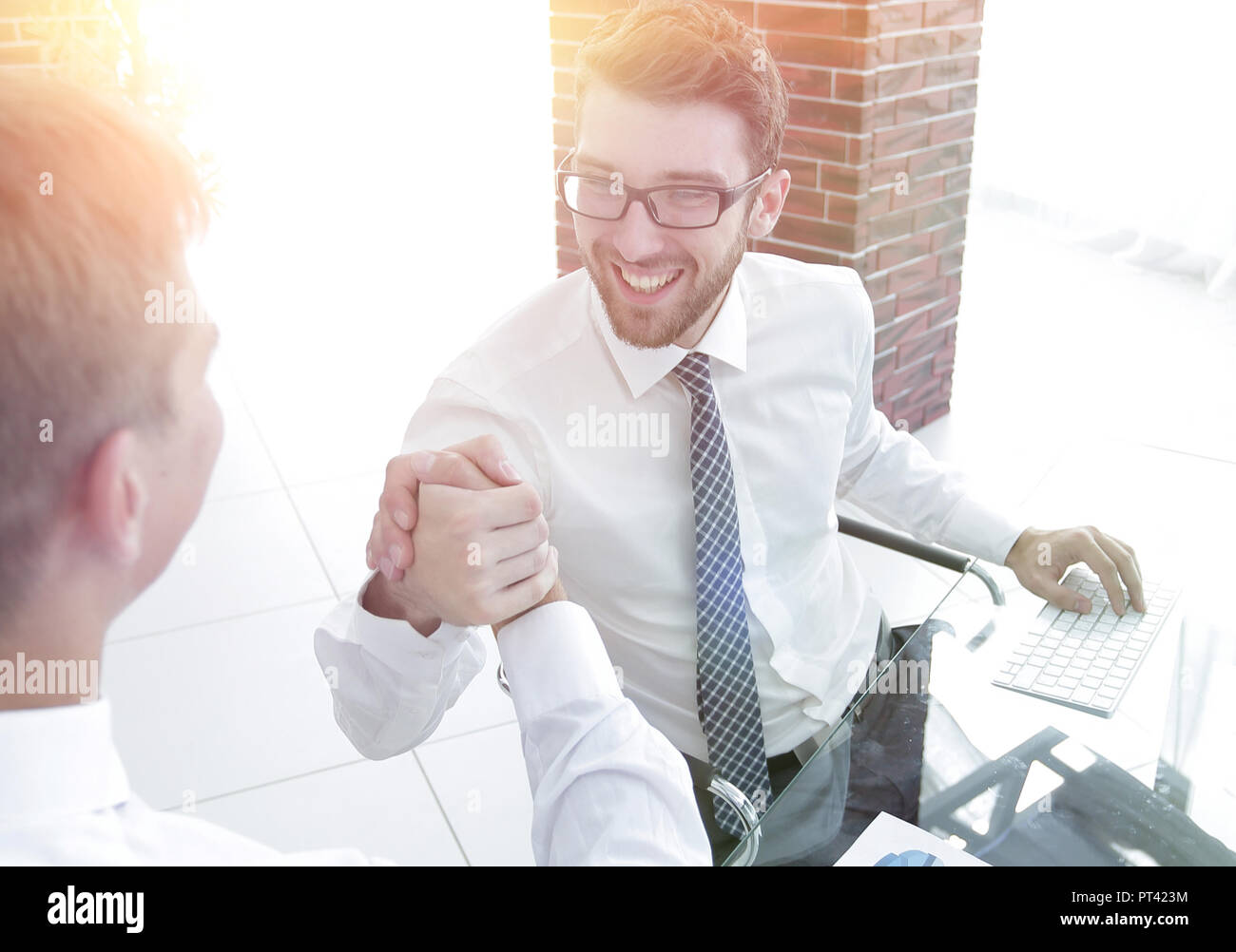 colleagues shaking hands after a successful transaction Stock Photo - Alamy