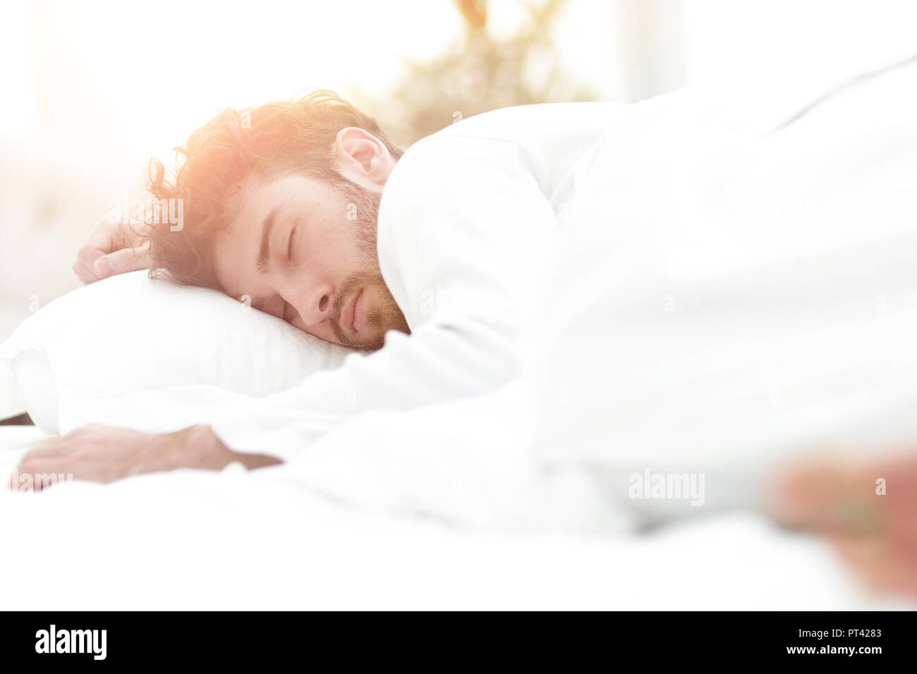 closeup.the tired men sleep soundly on the bed .photo with copy space ...