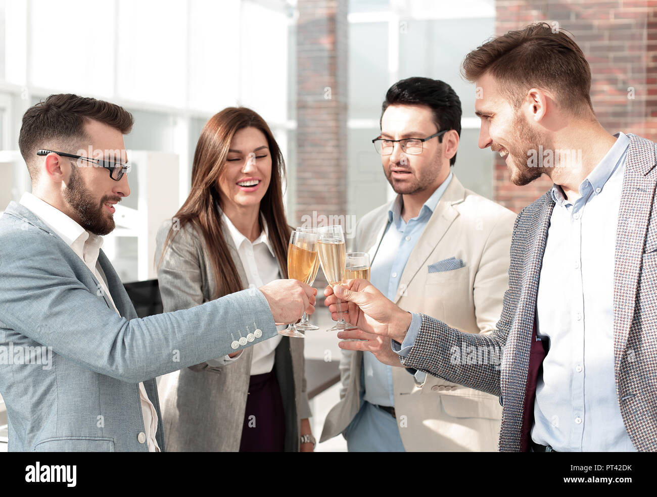 close up.business team raises their glasses.the concept of a startup ...