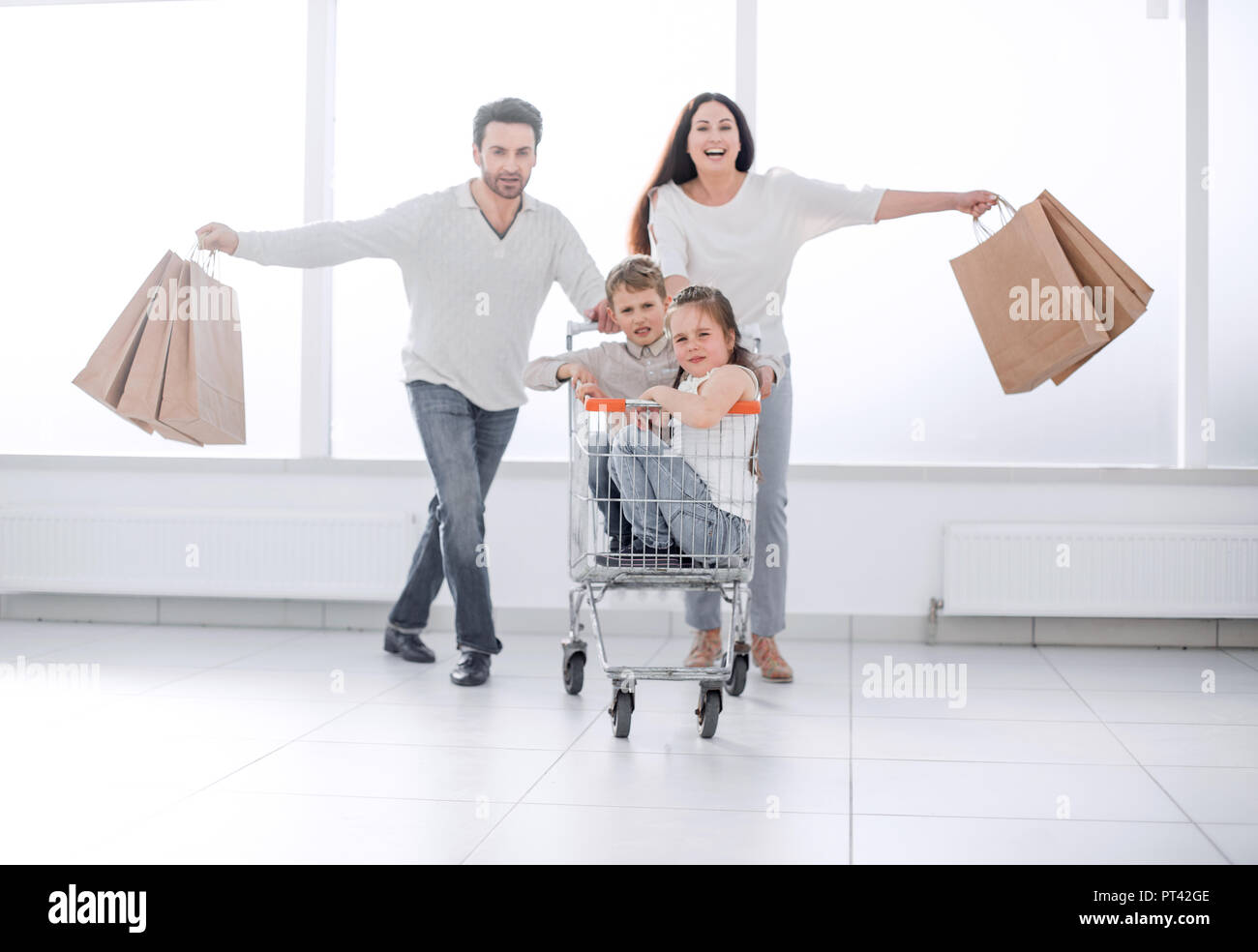 happy parents with children go shopping.shopping concep Stock Photo - Alamy