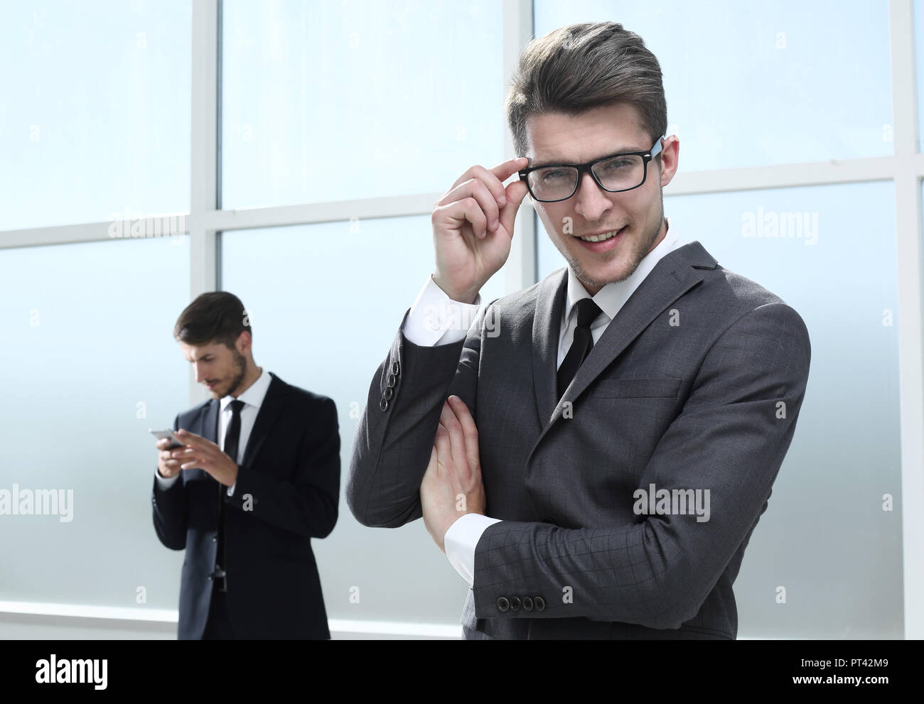confident, businessman, against, background, office Stock Photo - Alamy