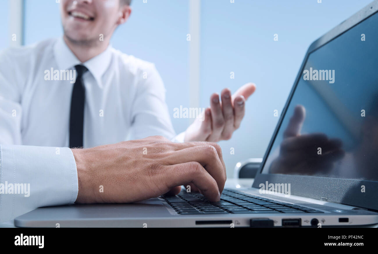 Close up of male hands typing on laptop keyboard. Business working ...