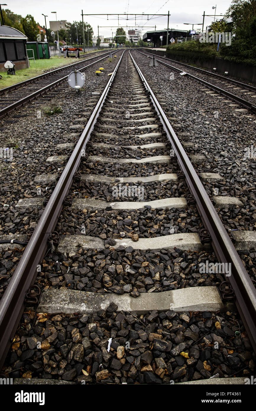 Train tracks in a station, transport detail by rails, trip Stock Photo ...