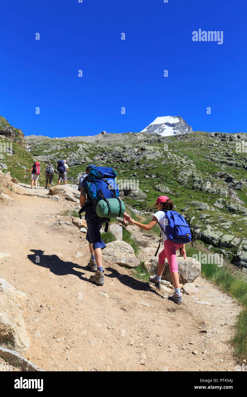 Family runs a trail leading to Vittorio Emanuele II hut overlooking ...