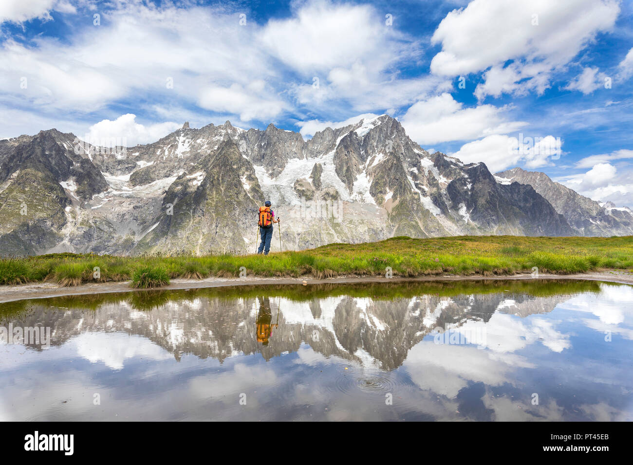 A girl is watching the Grandes Jorasses and the Mont Blanc Massif from ...