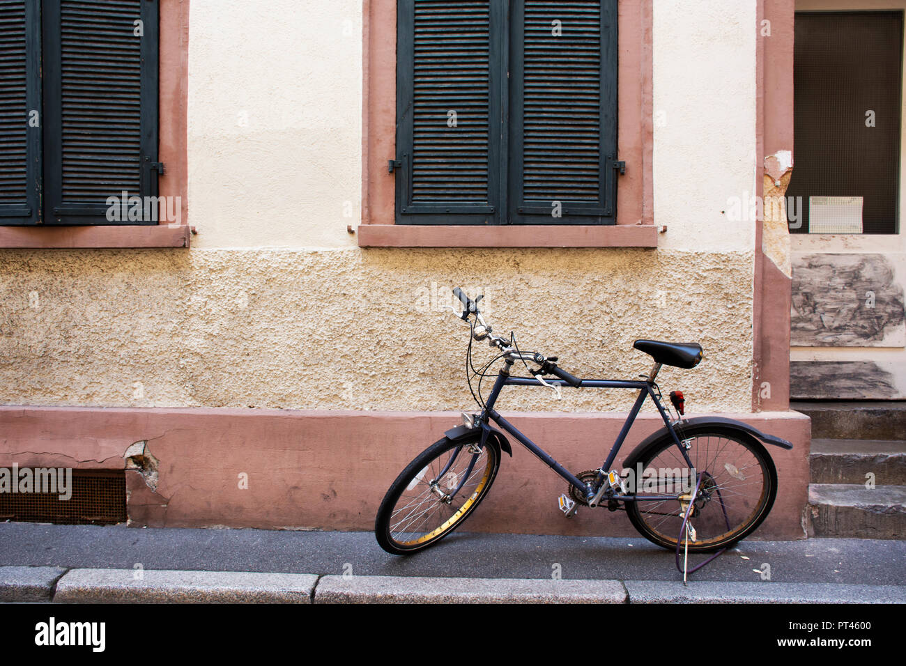 German people stopping and lock bicycle at front of classic and retro ...
