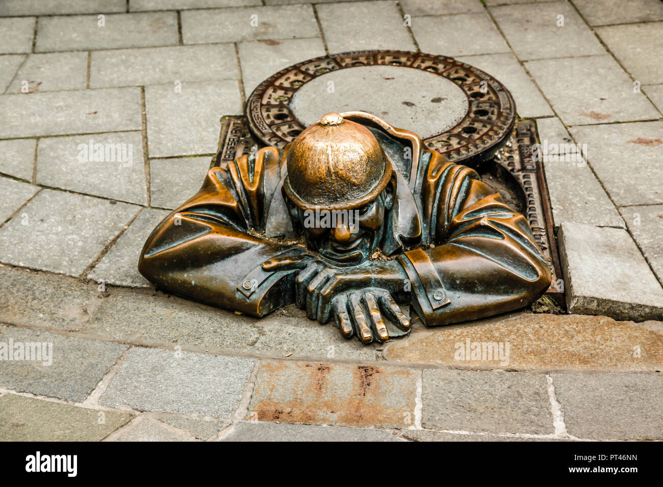 Bronze sculpture of a man in a manhole called "Man at Work" in ...