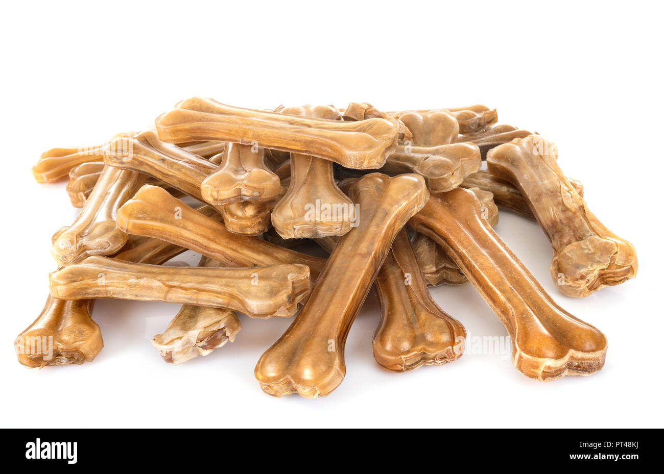 dog chew bones in front of white background Stock Photo - Alamy