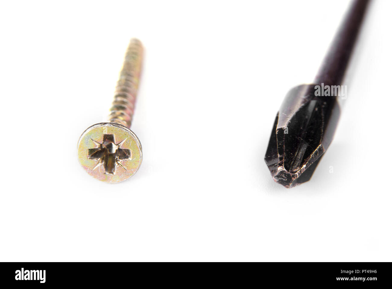 Closeup of the screw and screwdriver on the white background Stock ...