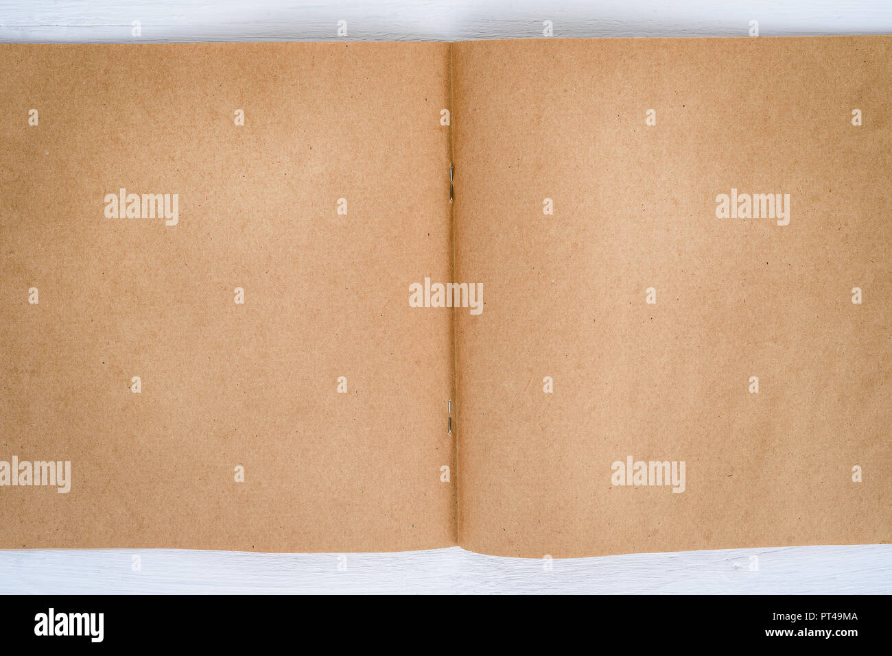 Blank notepad of kraft paper on white background Stock Photo - Alamy