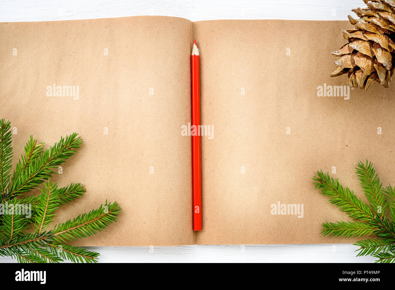 Blank notepad of kraft paper on a white background. Christmas ...
