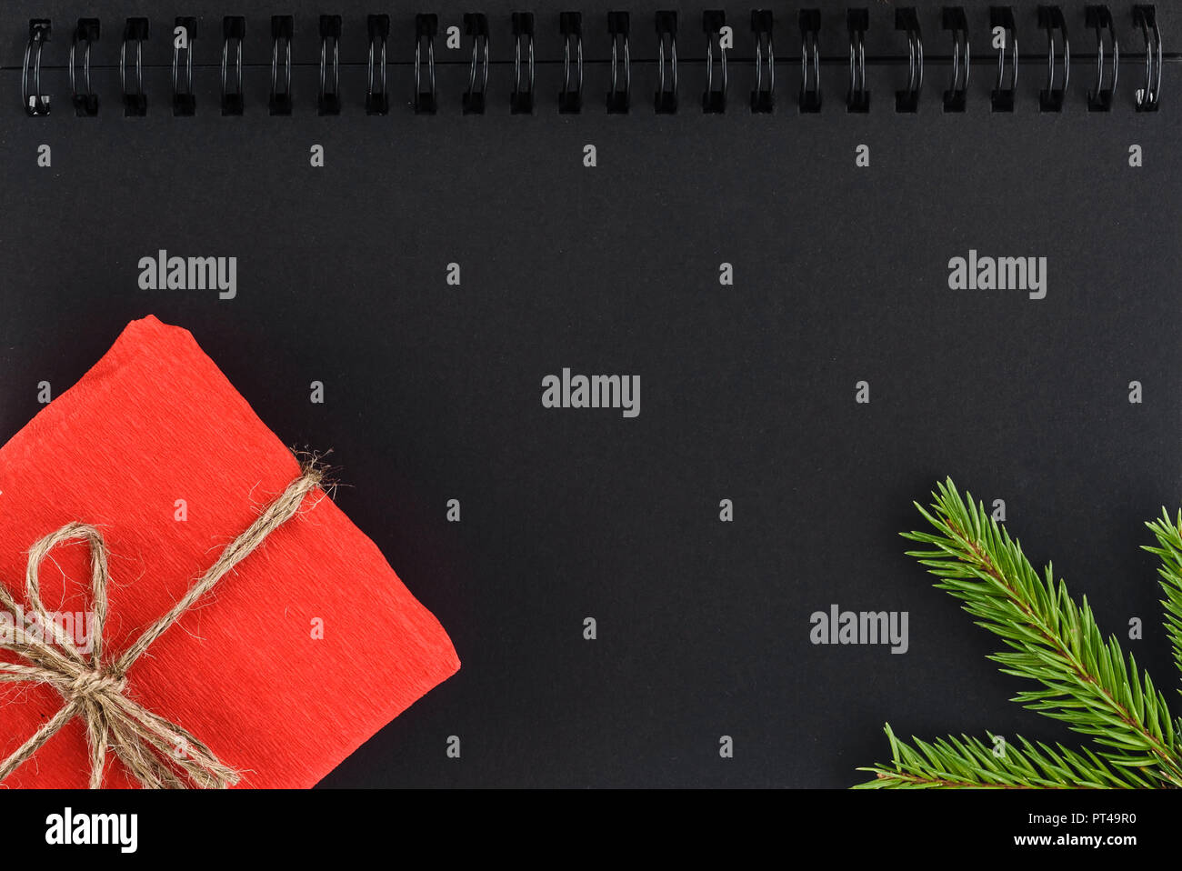 Christmas background on a black notepad sheet Stock Photo - Alamy