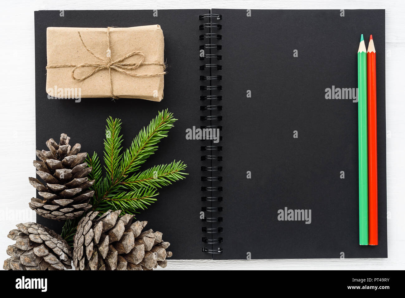 Christmas composition. Black Notebook with New Year decorations around ...