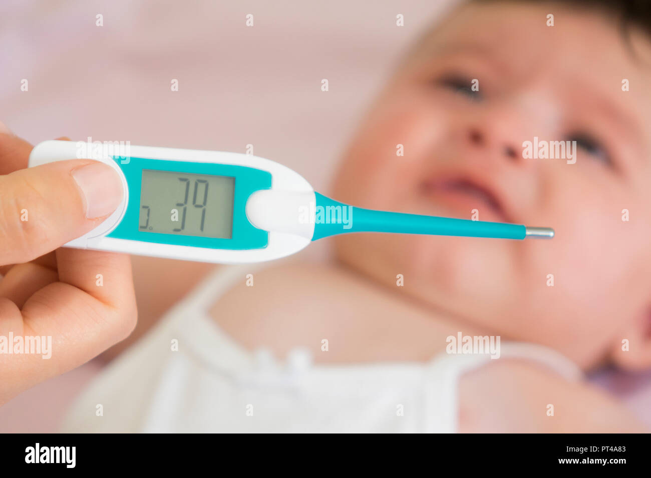 Baby sick with measuring electric thermometer. Child fever ill. Kid ...