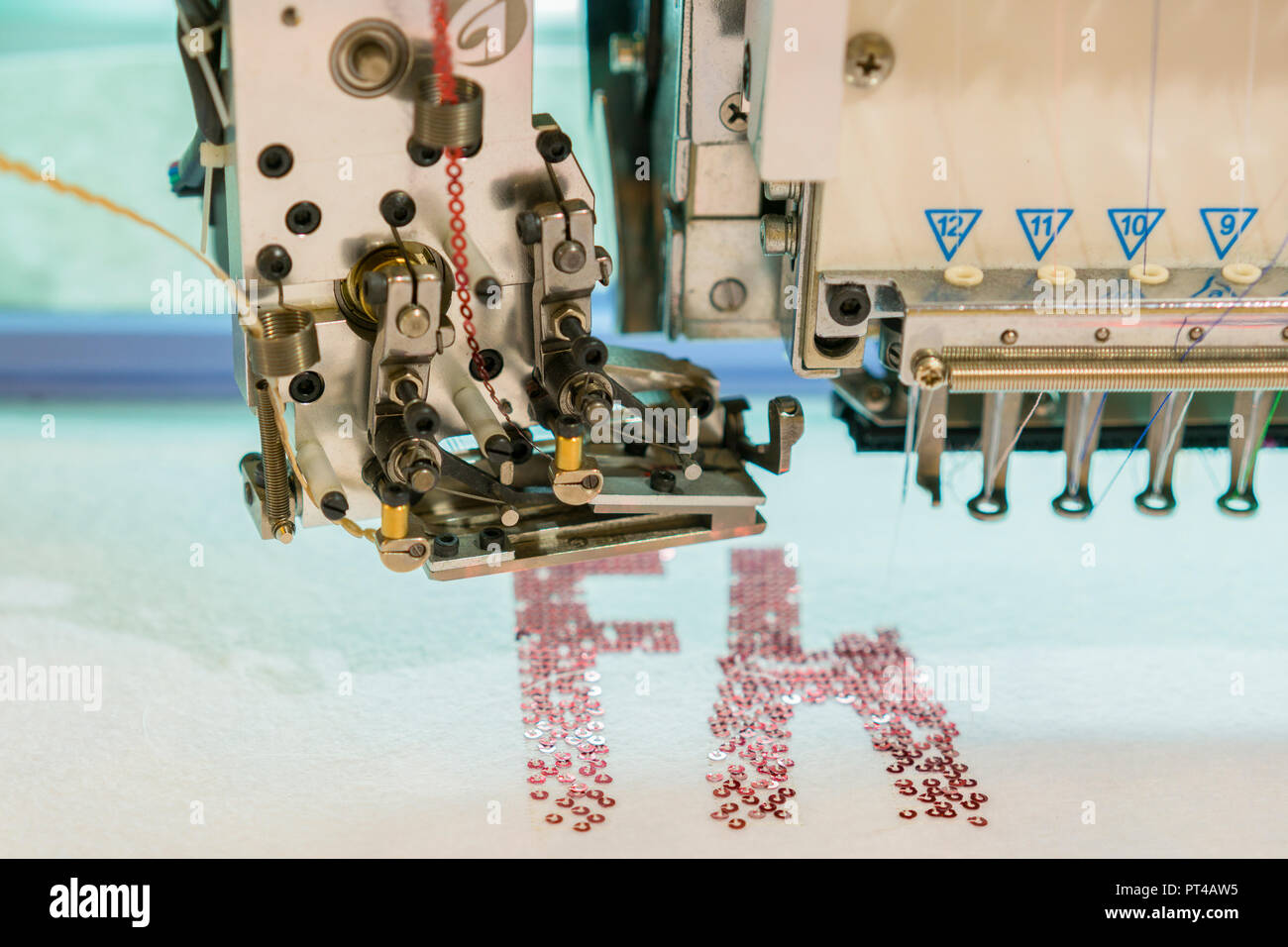 Computerized embroidery machines. sewing machine on blurred background ...