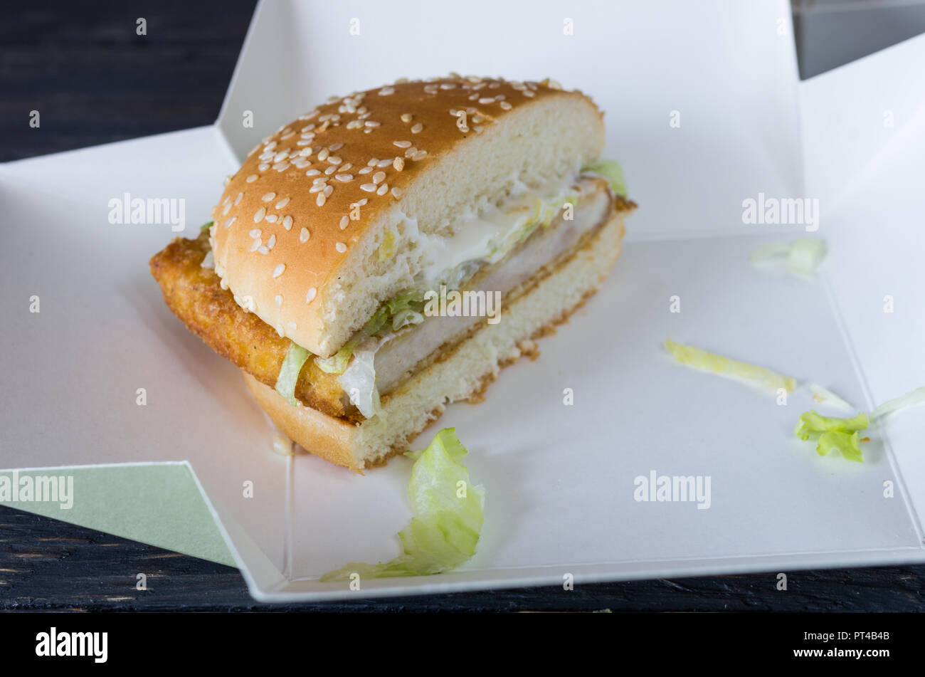 Half a hamburger. Cut hamburger. Hamburger in the box. Front view Stock ...