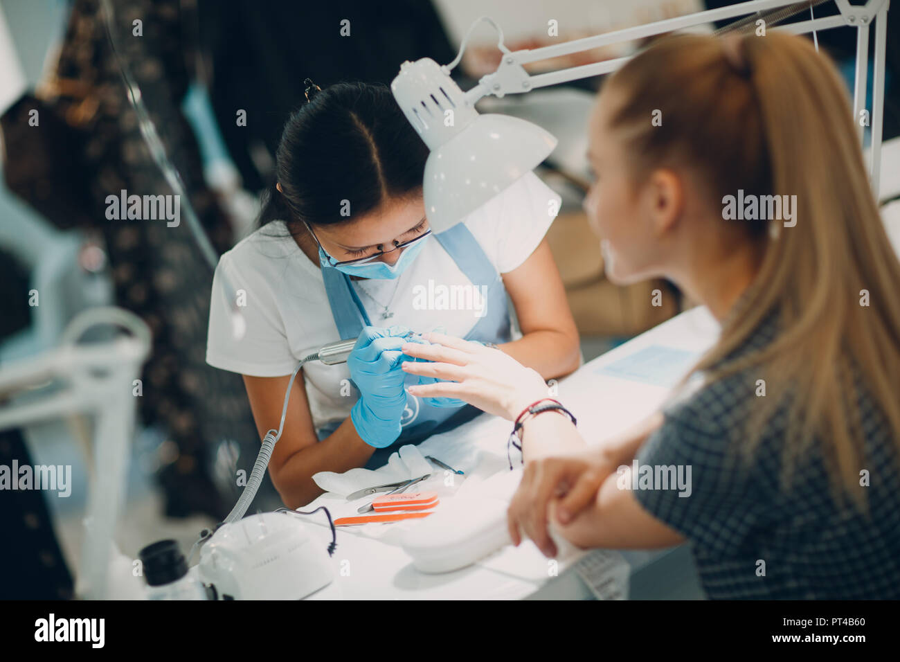 Manicure in beauty salon applying hi-res stock photography and images ...