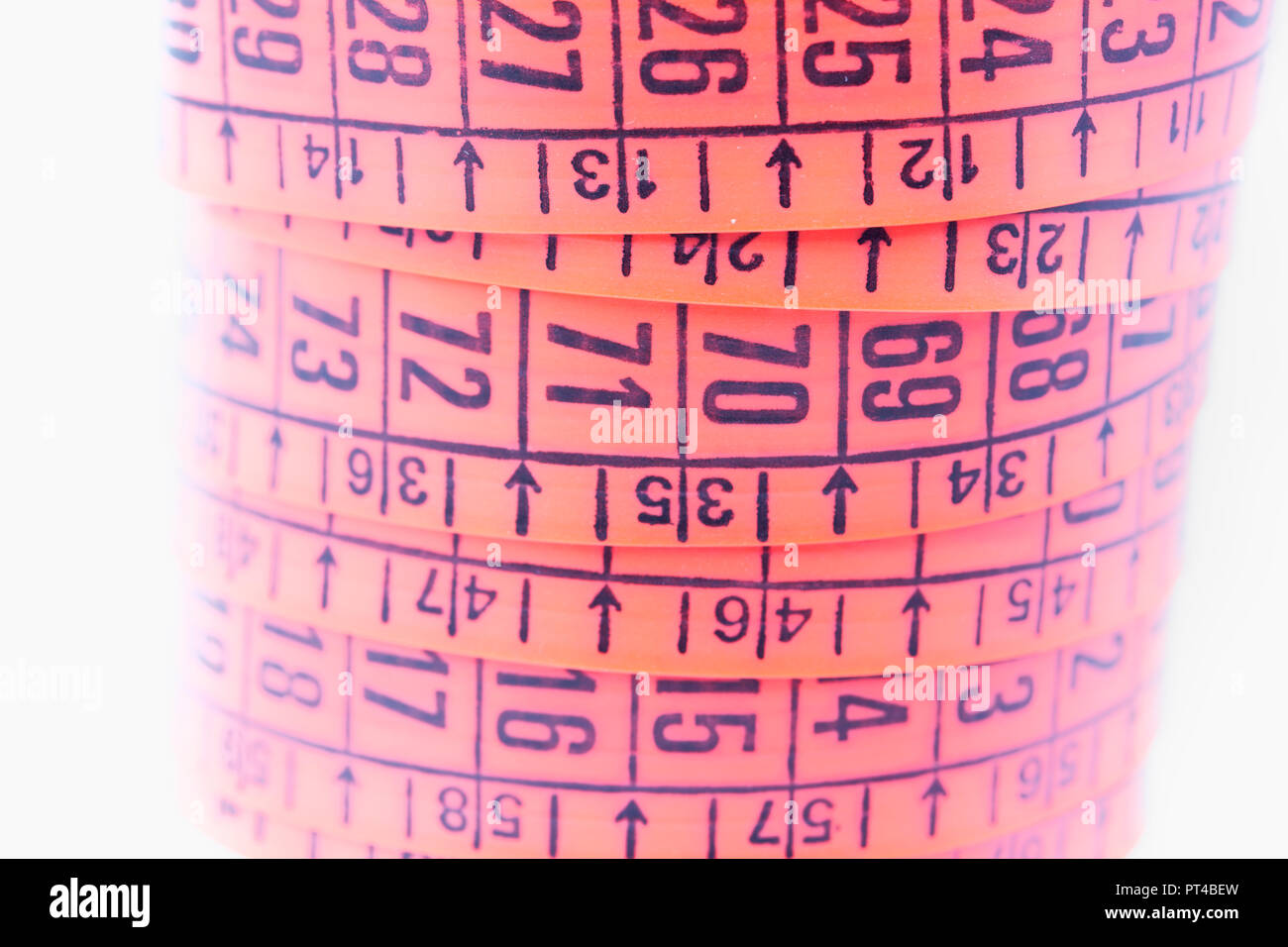 in the white light rotation of a red measure tape like concept measure ...