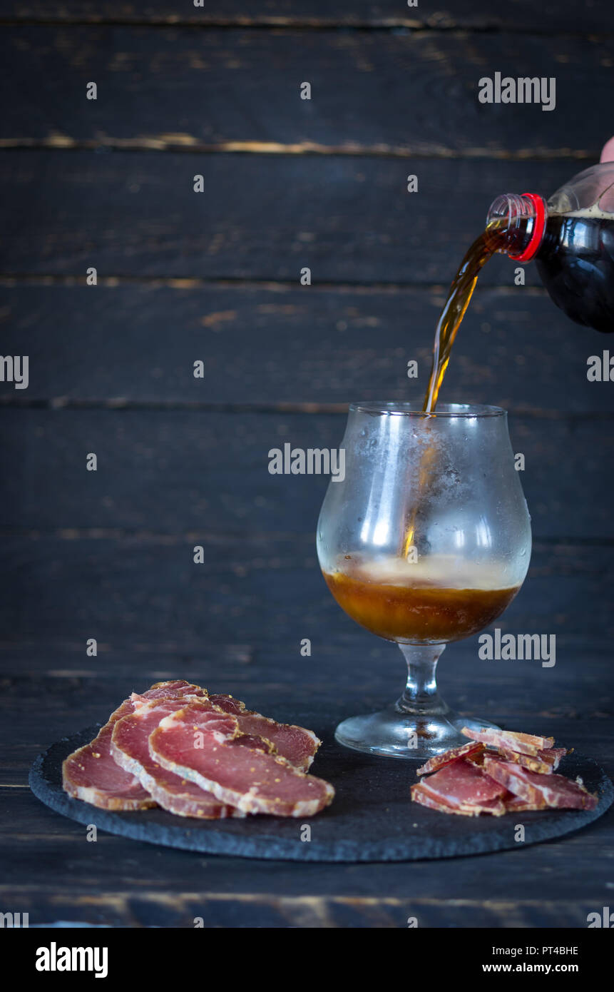 Filling a glass with beer. Pour beer into a glass. Vertical frame Stock ...