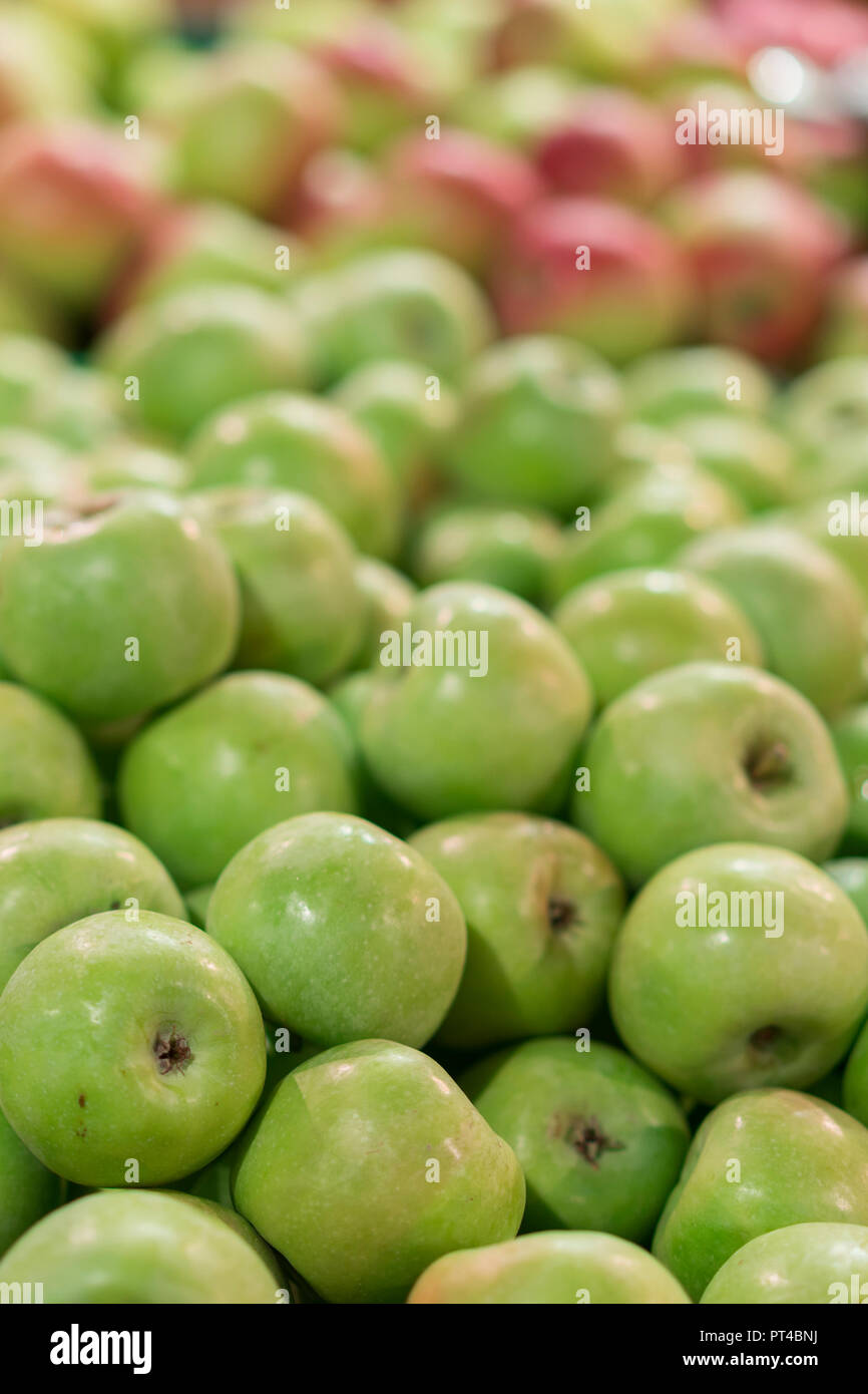 Green apples in a box in the store. green apples in boxes on market ...