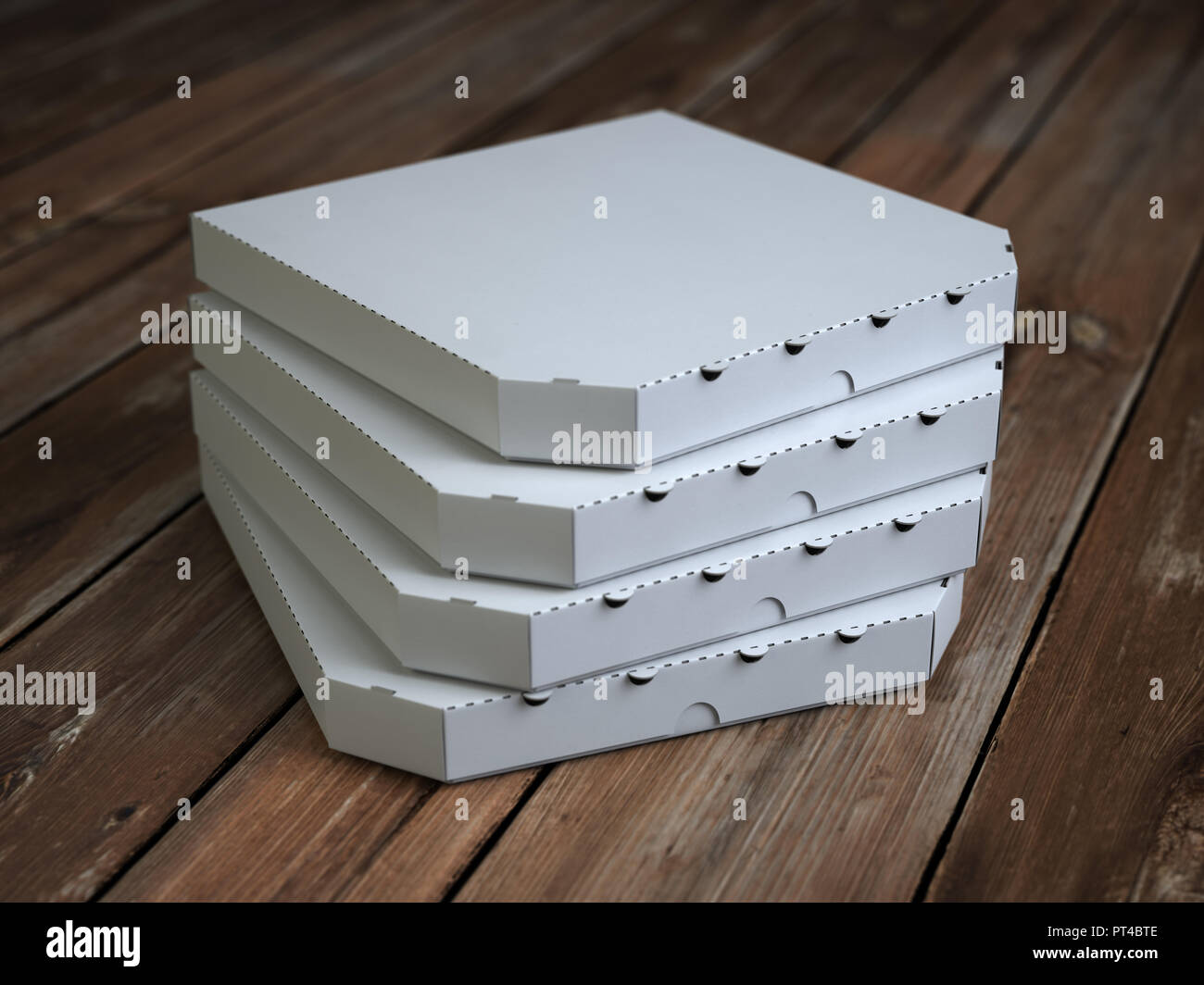 Pizza boxes on wooden table hi-res stock photography and images - Alamy