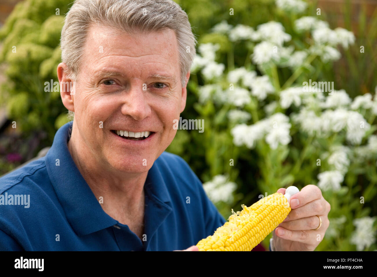 Senior man enjoying corn on the cob, USA Stock Photo - Alamy