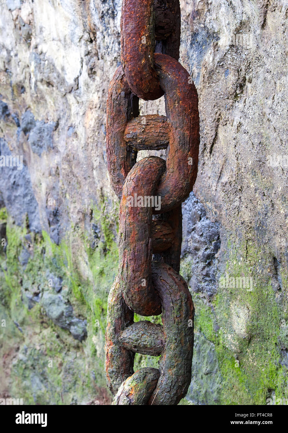 Rusty chains with stone background Stock Photo - Alamy