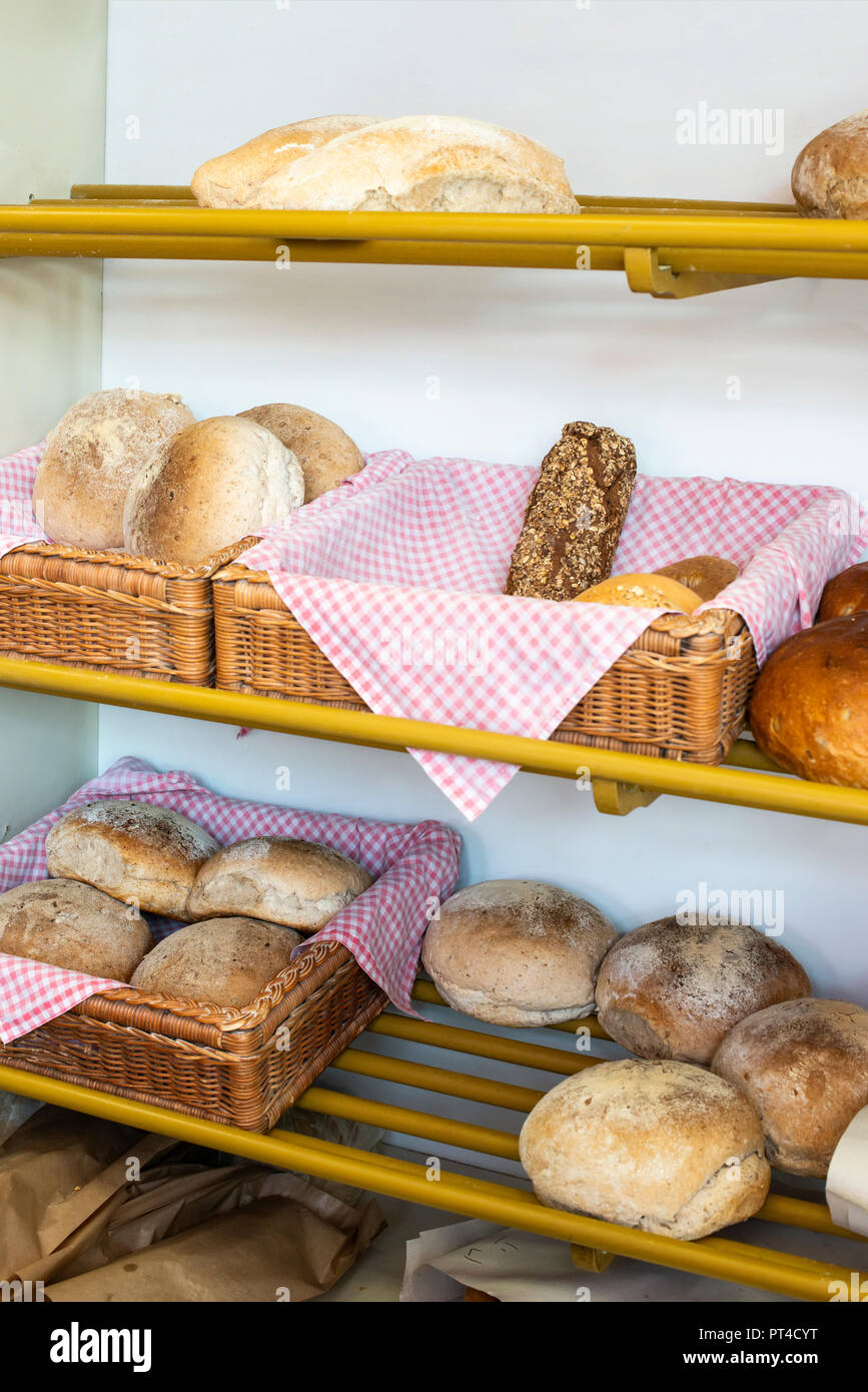 Bread in bakery shelf. Small neighborhood bakery Stock Photo - Alamy