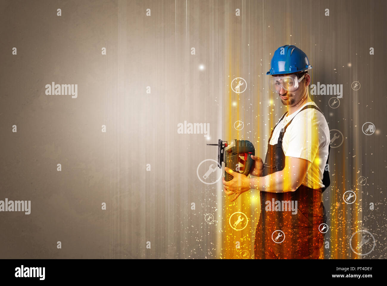 Manual worker with wrench symbols and tool Stock Photo - Alamy