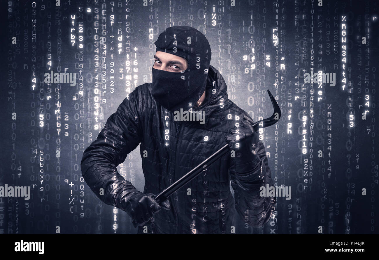 Burglar in action with encoded concept and his tools in his hand Stock ...